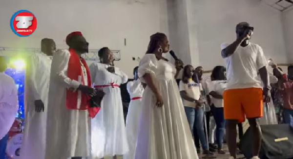 Ras Nene joins Obaa Christy on stage during performance