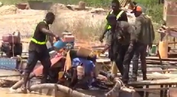 Watch as small-scale miners taskforce burn illegal river mining machines