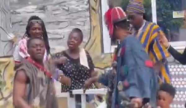 Watch as fetish priest storms church for charm he allegedly gave to a ...